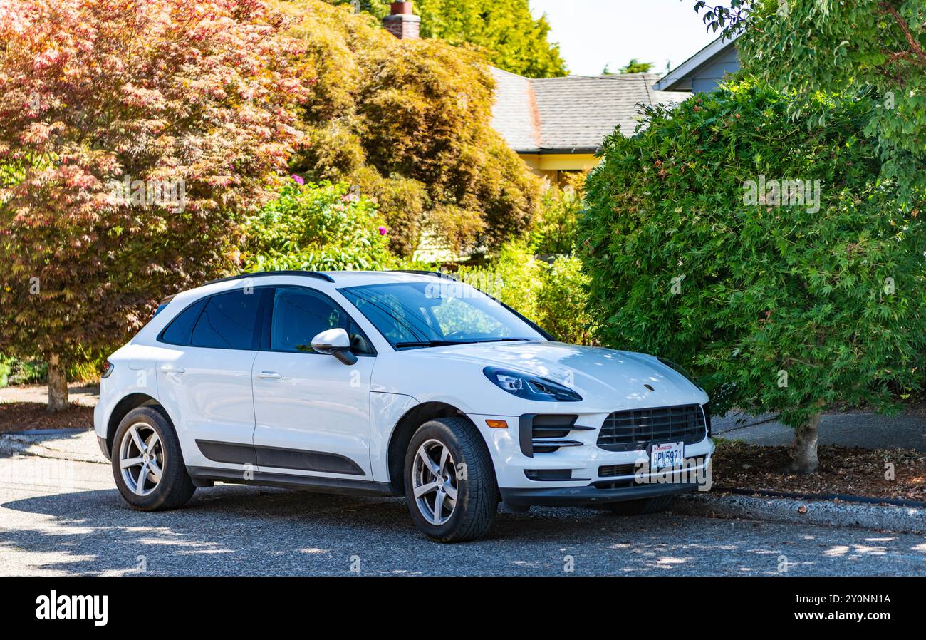 Seattle, WA, USA -July 3, 2024: Porsche Macan Turbo S white color side ...