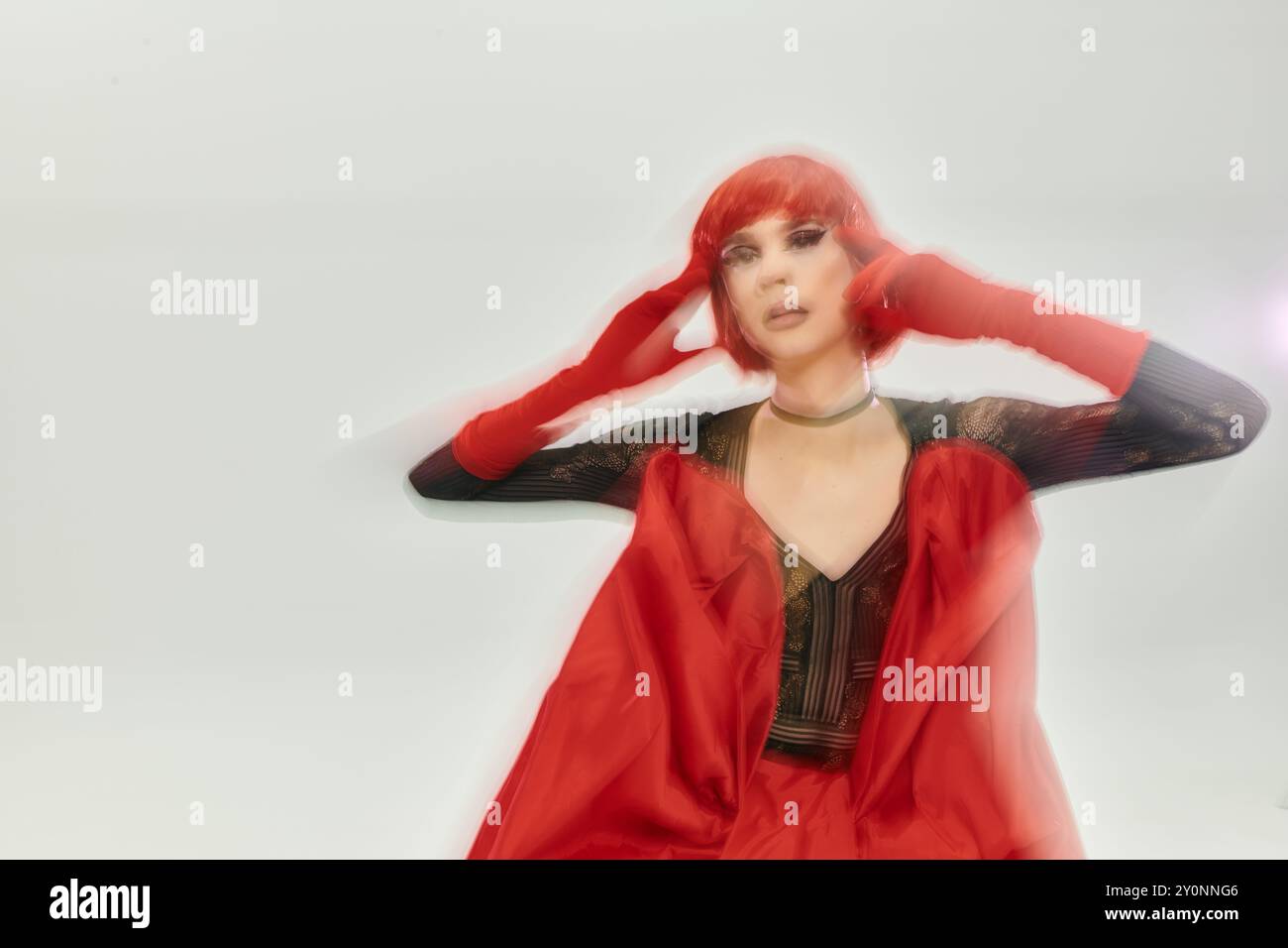 Stunning drag queen flaunts a striking outfit with vibrant colors and ...