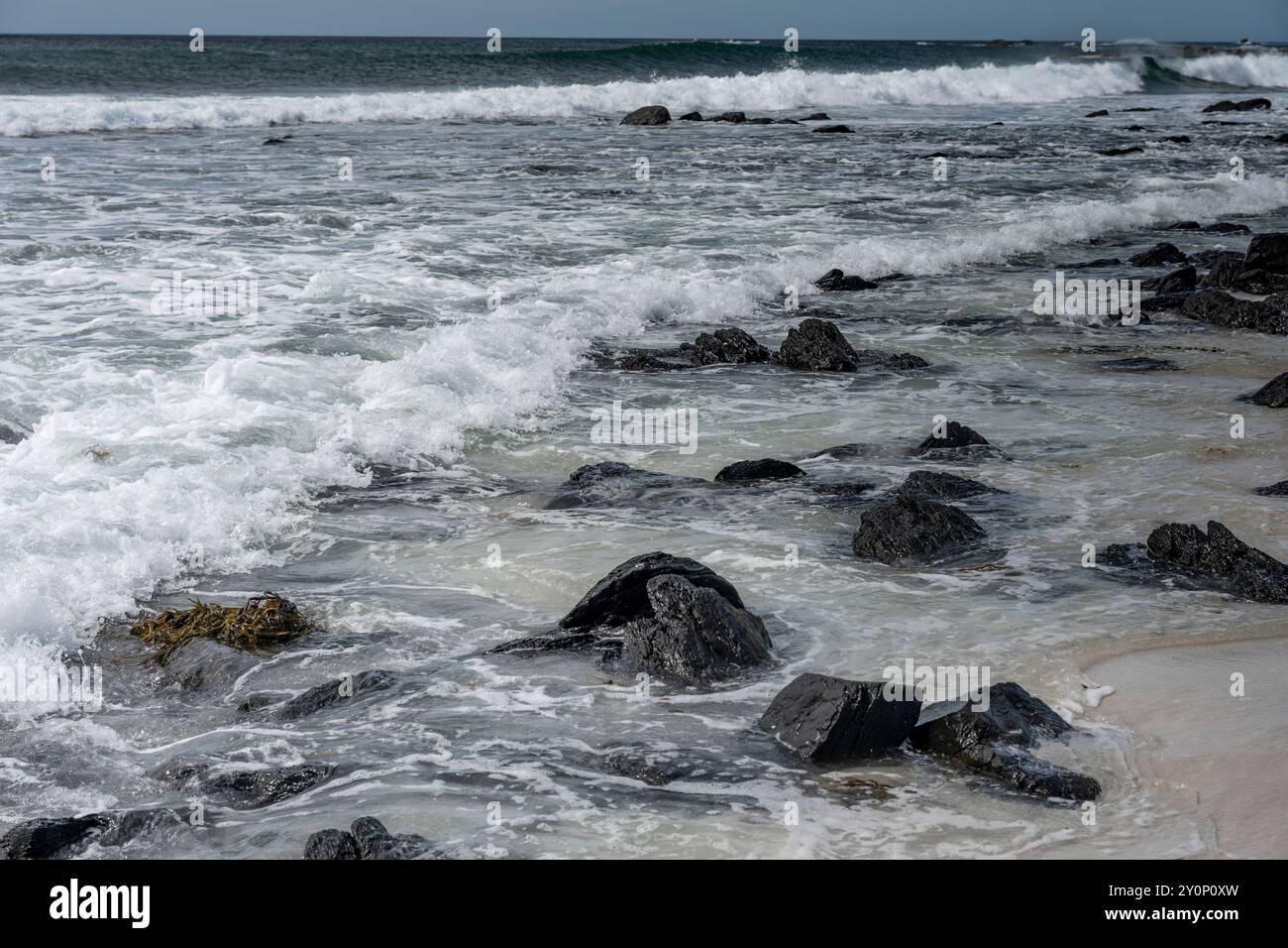 Rocky shoreline at The Bay of Fires which was given its name in 1773 by ...