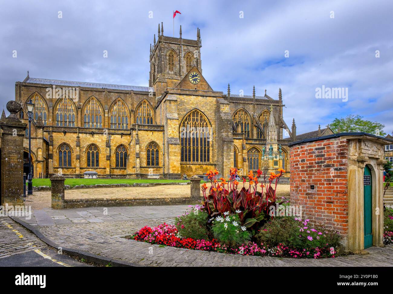 Sherborne Abbey with stunning gothic architecture, fronted by vibrant ...