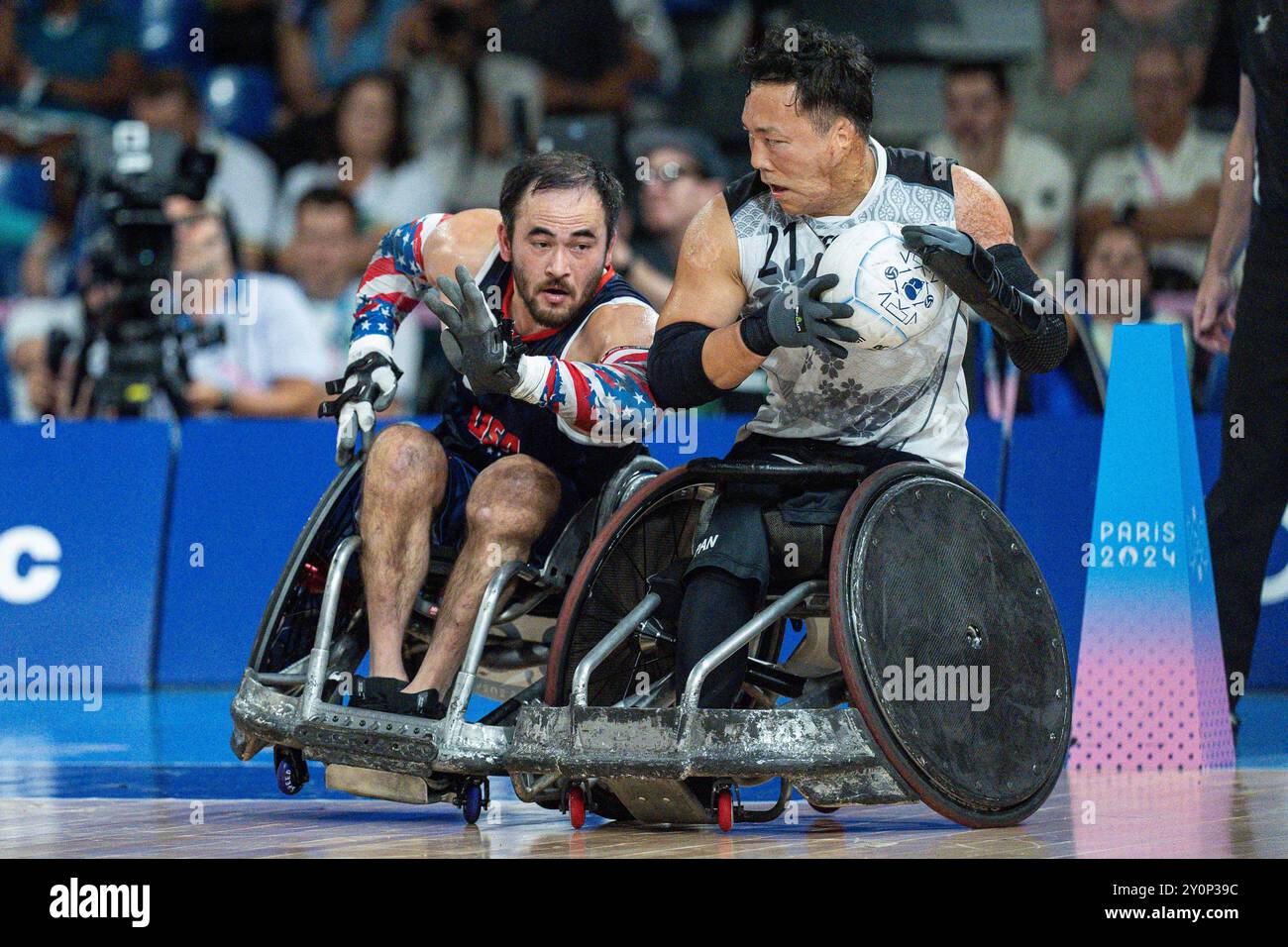 United States Chuck Aoki (5) defends against Japan Yukinobu Ike (21 ...