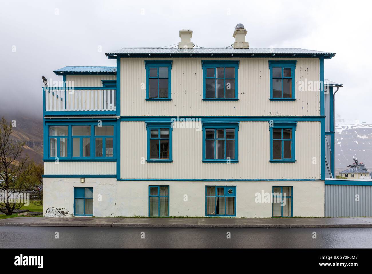 Traditional Icelandic white residential building with blue window ...