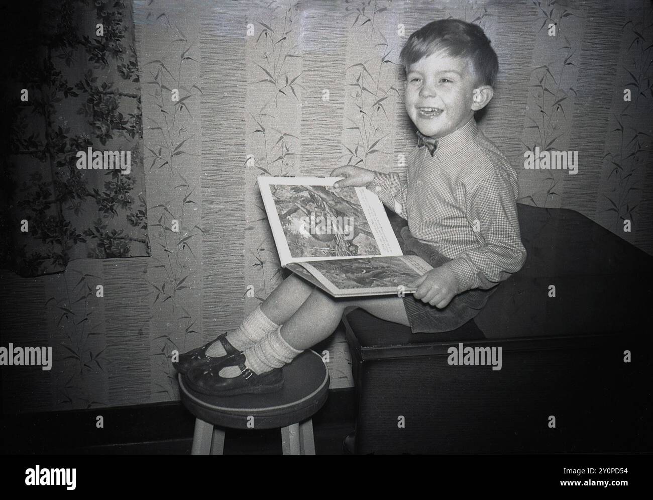 1950s, historical, a little boy, shirt and bowtie, big smile on his ...