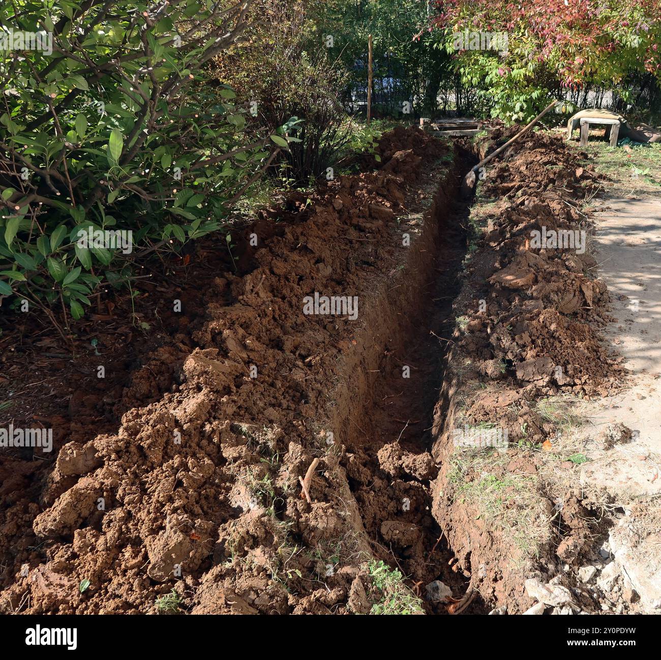 digging water supply channel in a private yard Stock Photo - Alamy