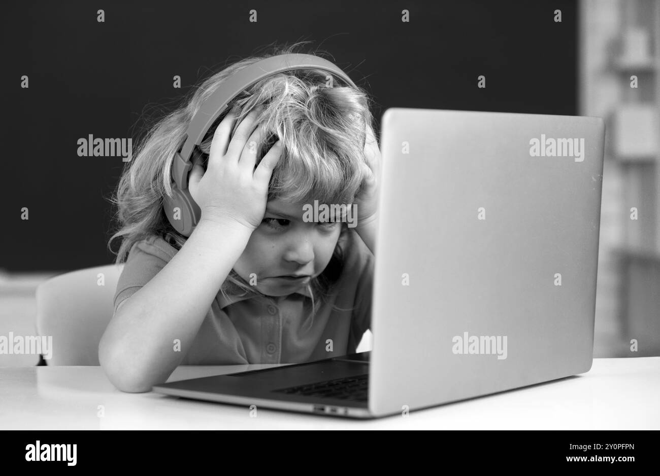 Angry sad child using laptop computer, kid boy studying through online ...