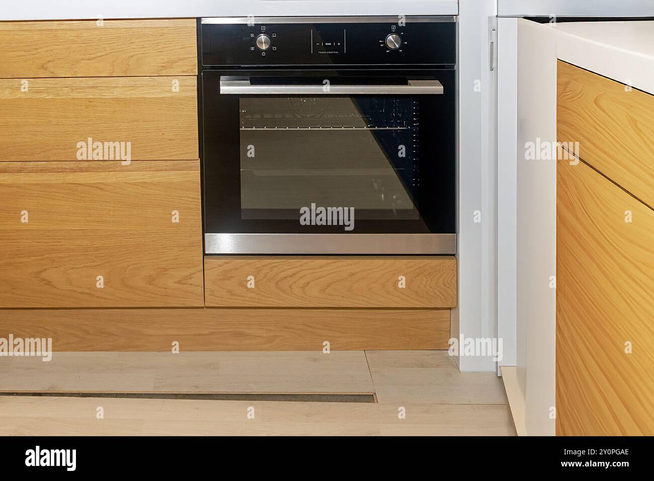 Modern stove with closed oven in a kitchen interior corner Stock Photo ...