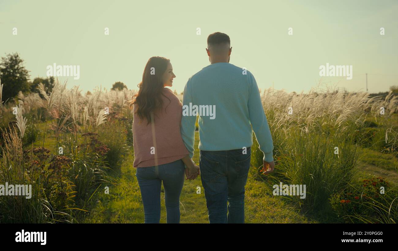 Back view happy family Caucasian married couple loving man kissing ... Back view happy family Caucasian married couple loving man kissing ...