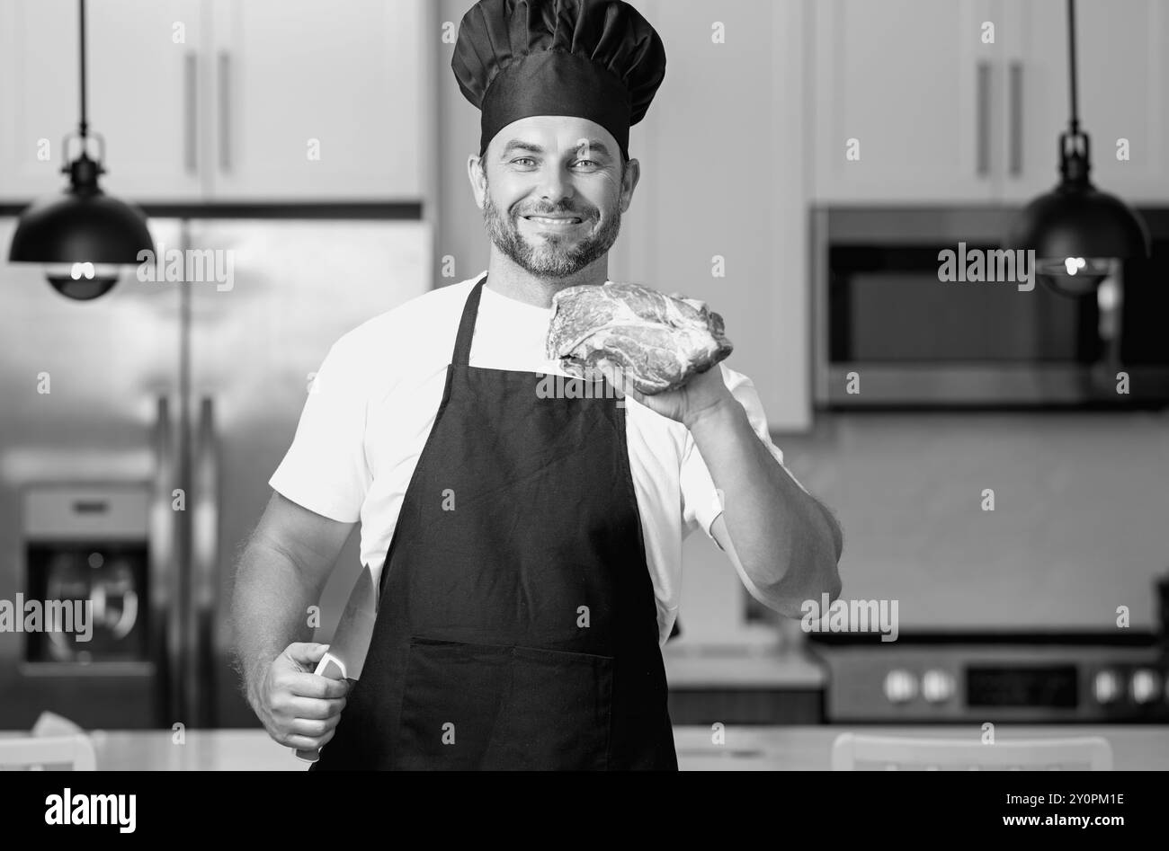 Chef cooking raw meat fillet in the kitchen. Restaurant menu concept ...