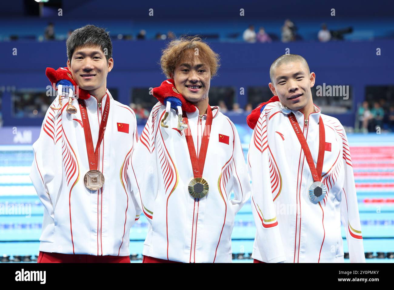 Yuan Weiyi, Guo Jincheng and Wang Linchao, of China, celebrate their first, second and third ...