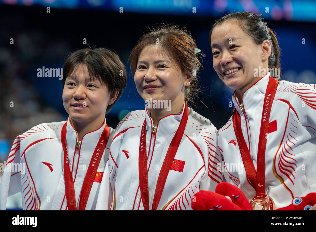 Lu Dong, He Shenggao and Liu Yu, of China, celebrate their first ...