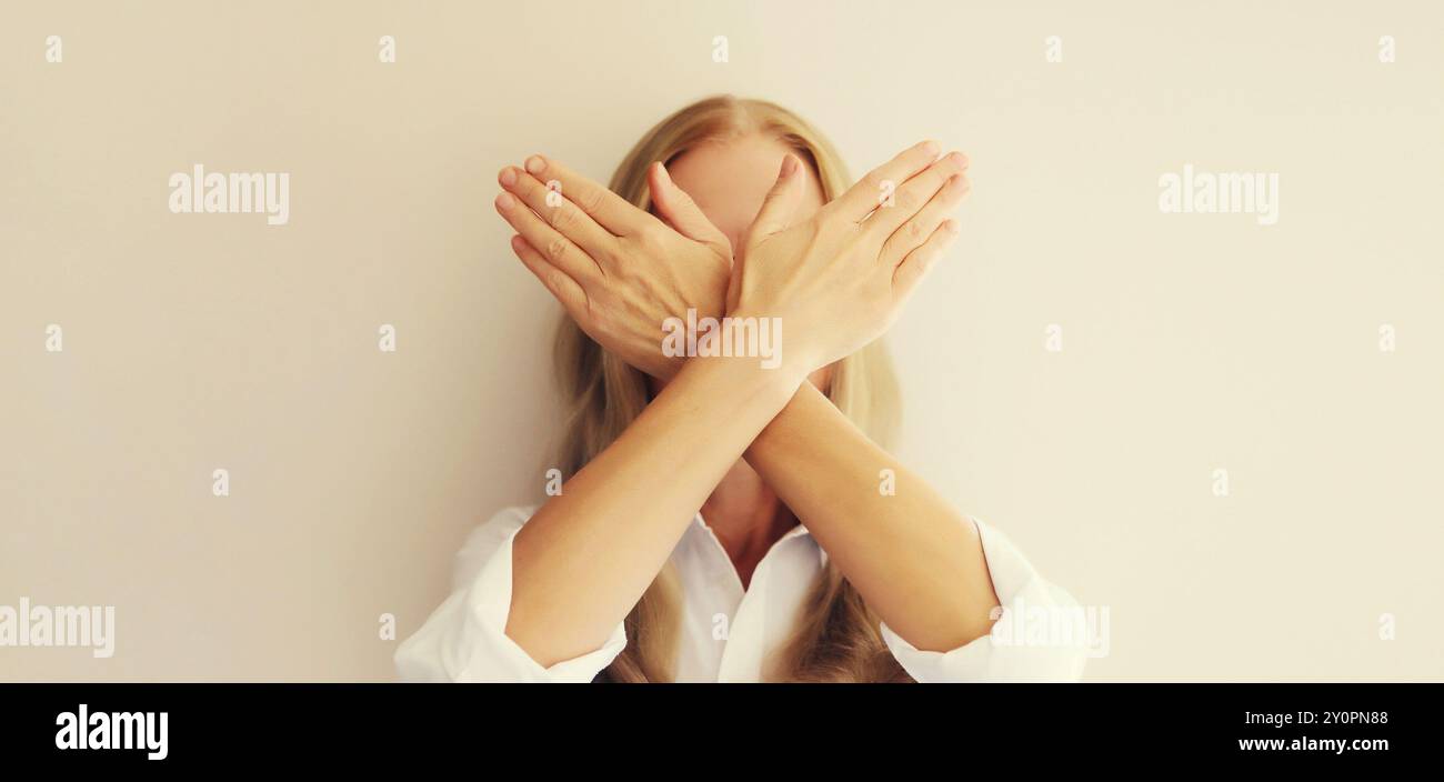 Upset woman shows stop, no or enough sign with palm of hand, refusal ...