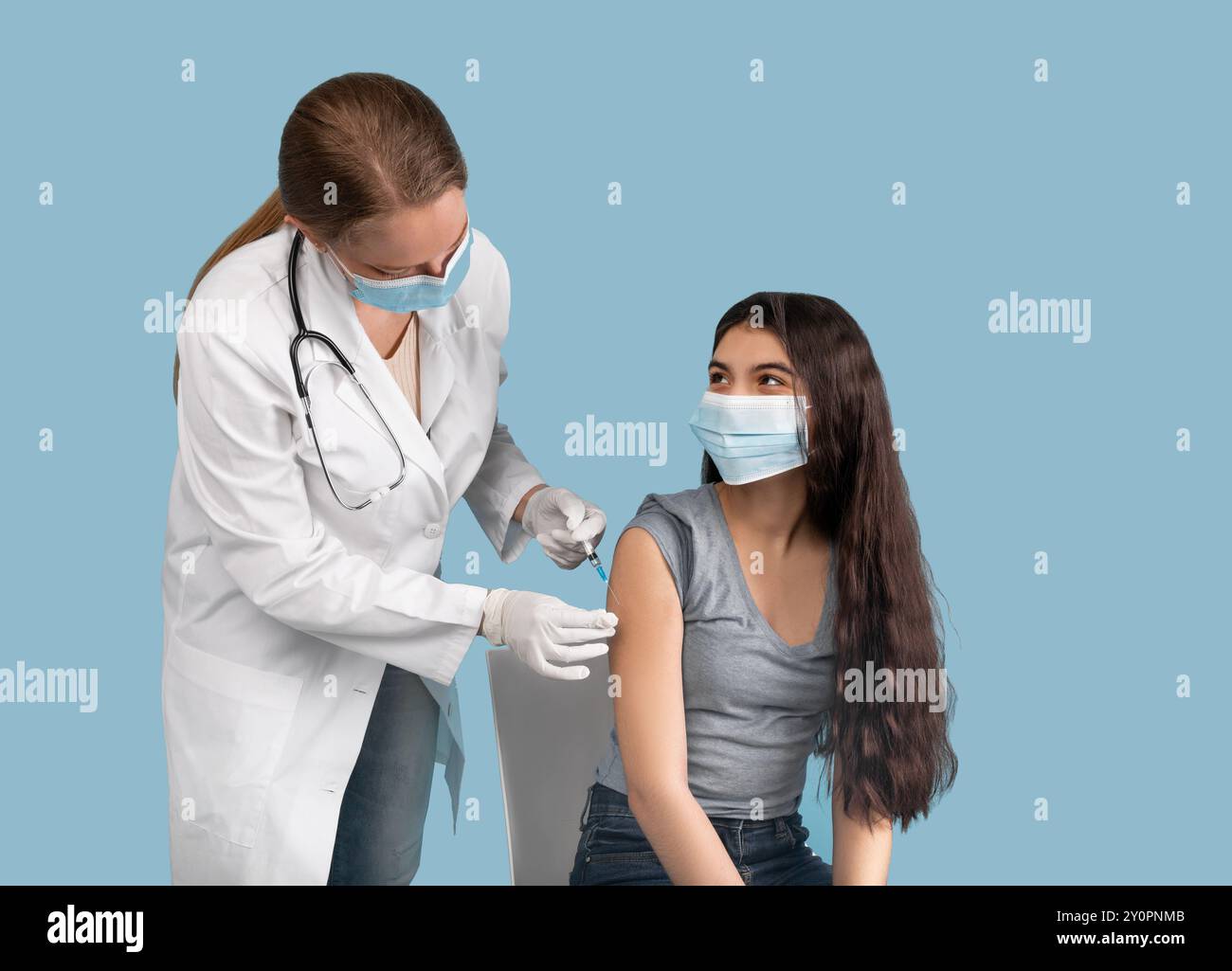 Medical doctor or nurse giving coronavirus vaccine shot to Indian teen ...