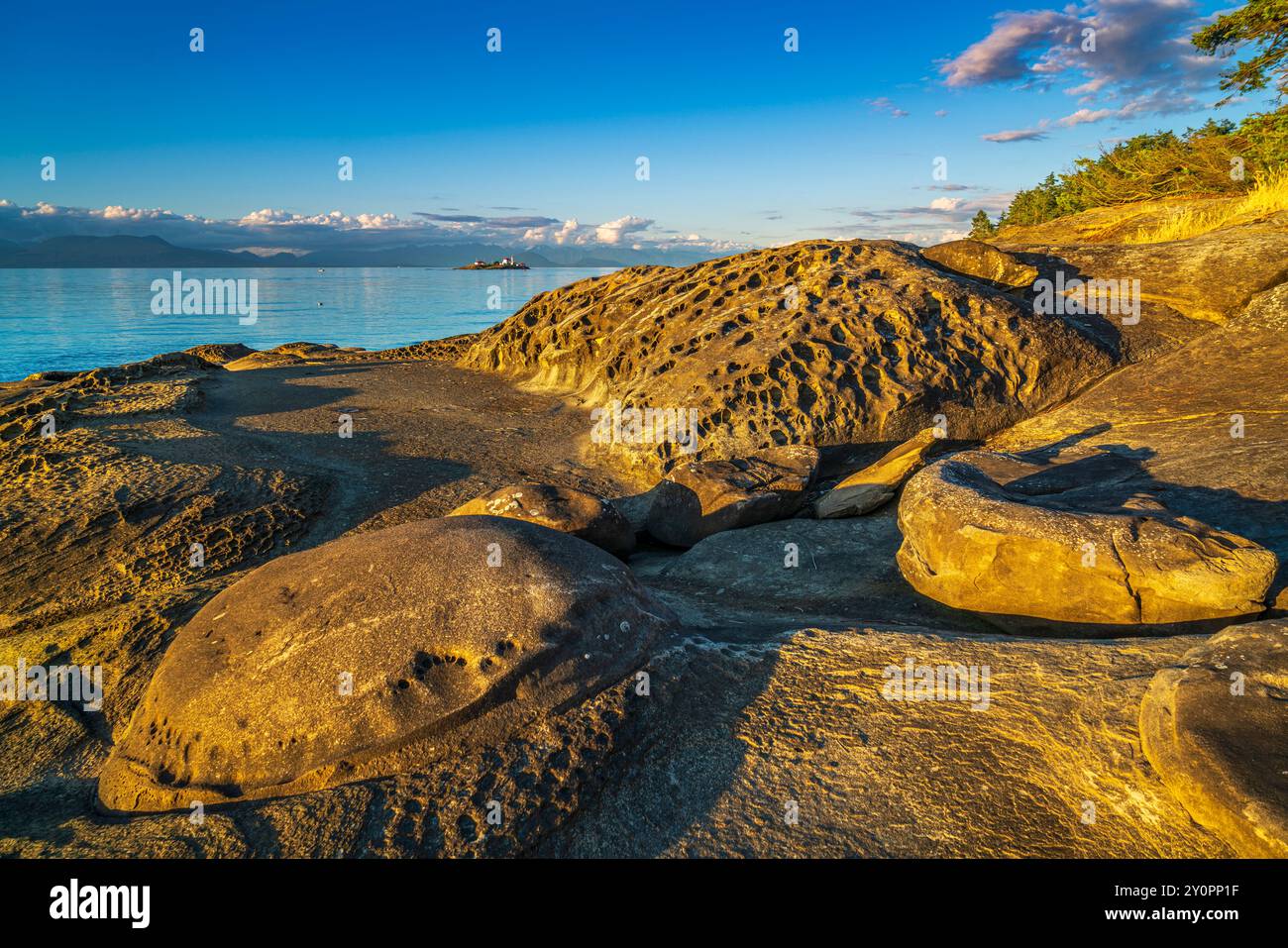 Weathered sandstone rock formations known as tafoni along the northeast ...