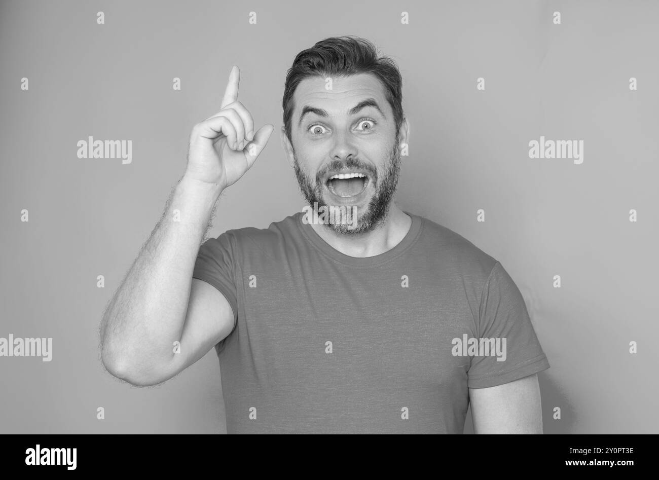 Surprised man thinking of idea on studio background. Portrait of man ...