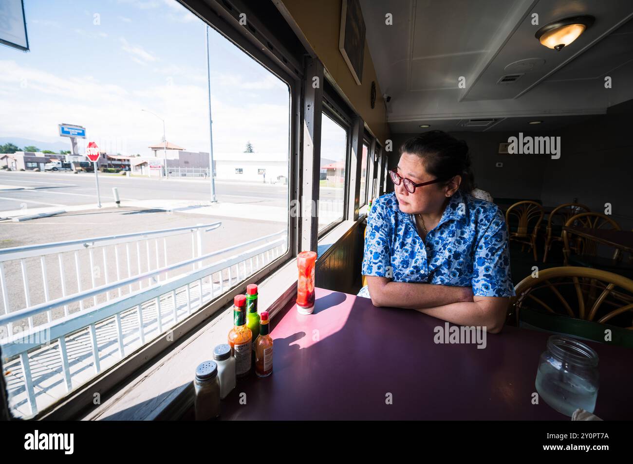 A woman inside a restaurant located in an old train dinning car. Baker City OR, USA Stock Photo ...