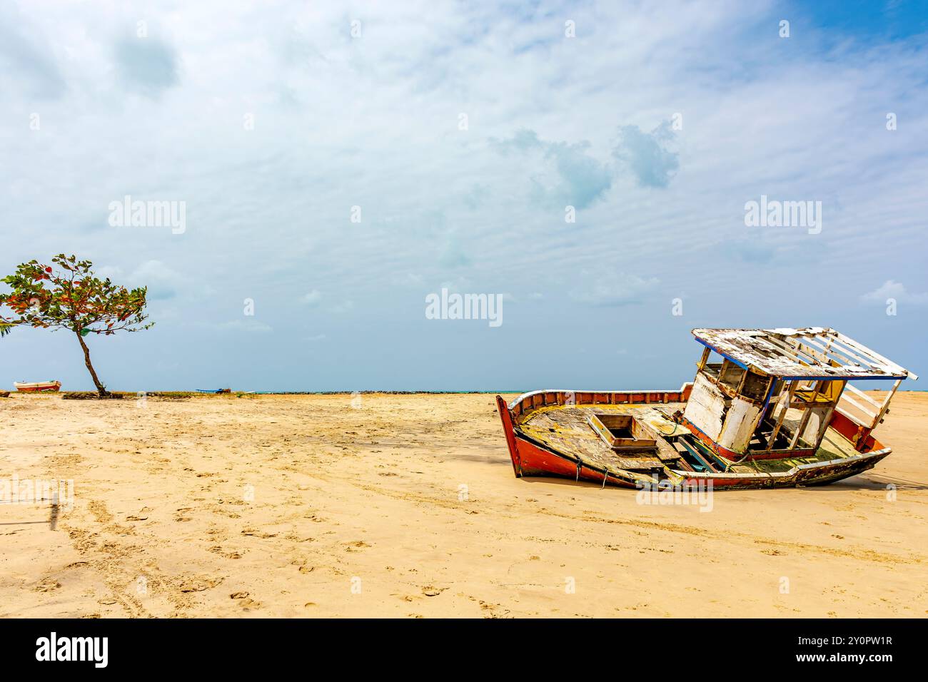 Deteriorated fishing trawler stranded on the beach sand in Olinda ...