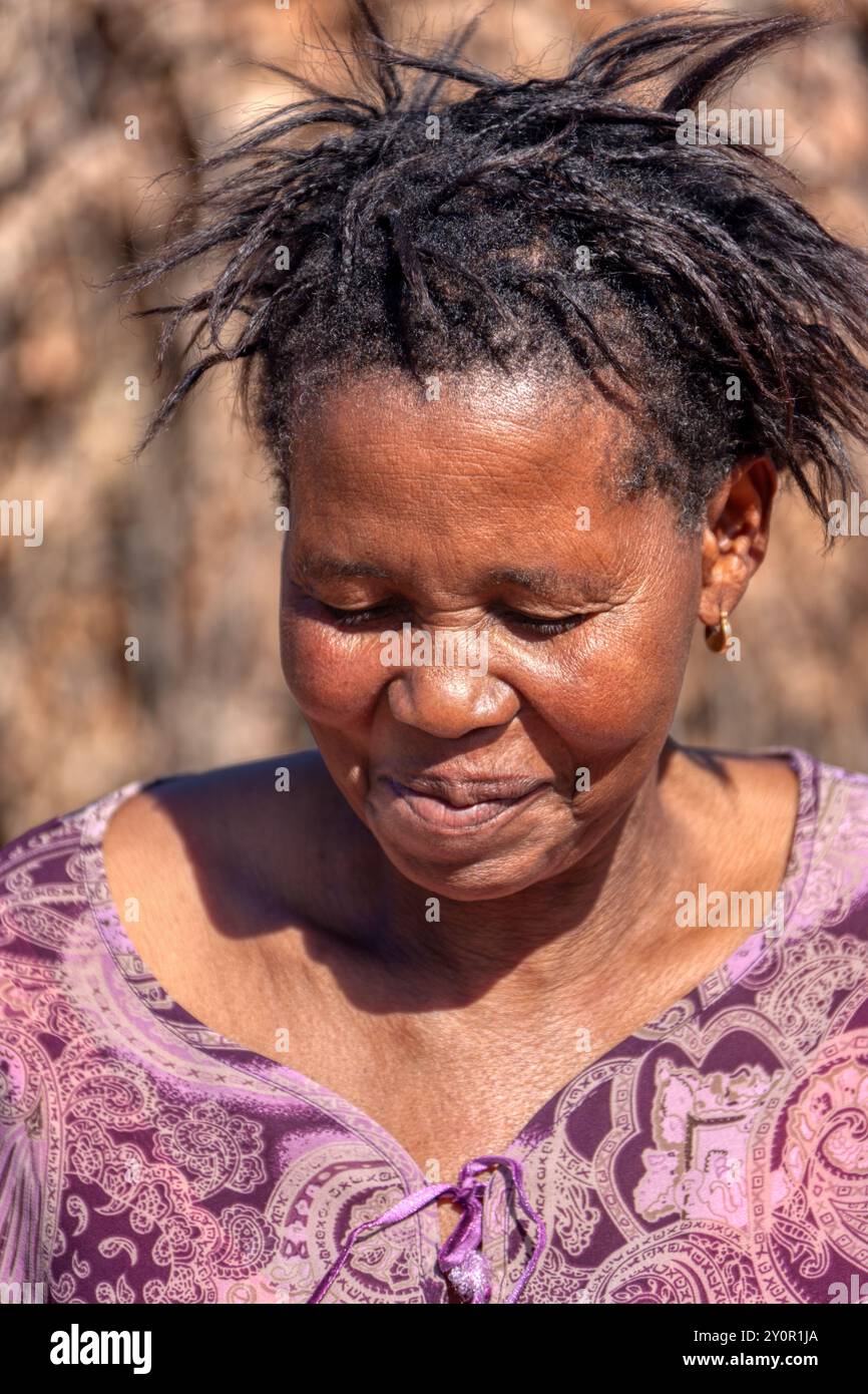 half portrait of old african woman with braids in the village Stock ...