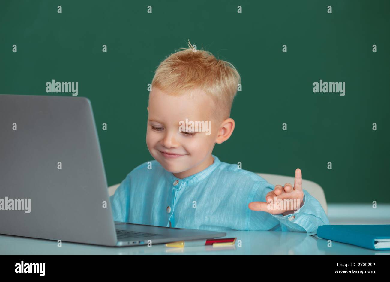 Happy child using gadgets to study. Computer education for kids. Funny ...