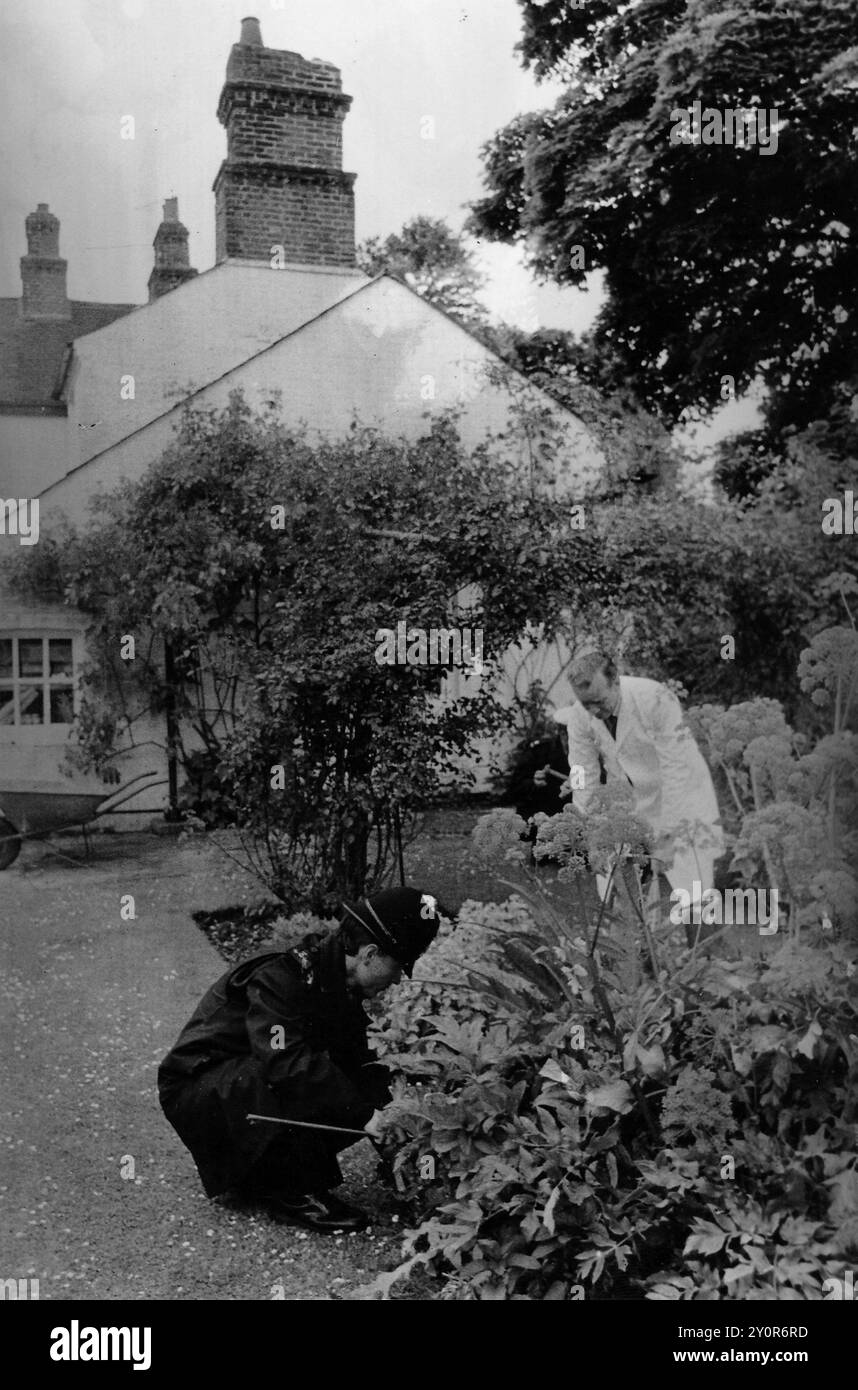 POLICE SEARCH FOR CLUES AT THE COTTAGE IN OVING, WEST SUSSEX, WHERE ...