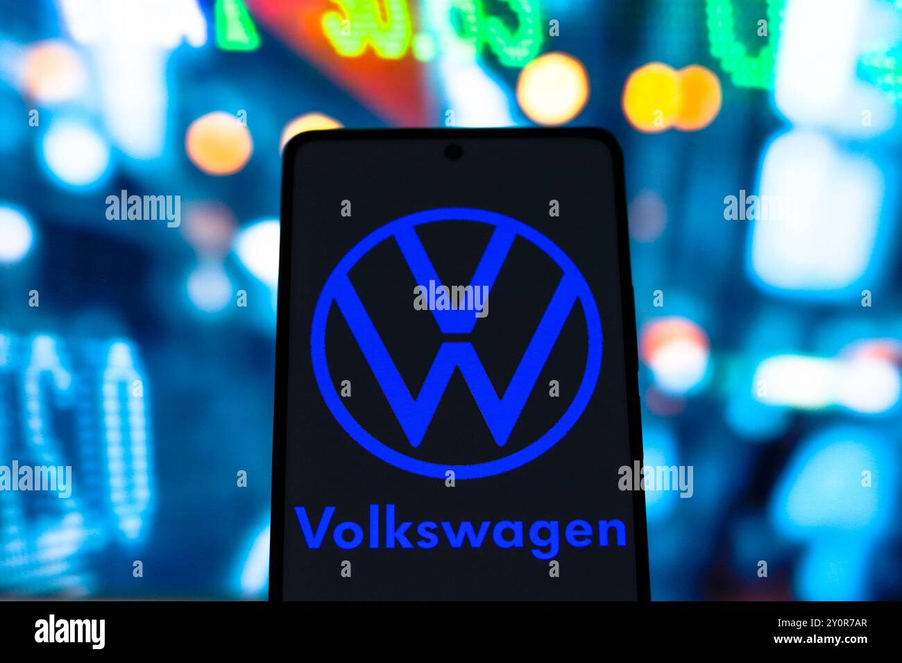 In this photo illustration, the Volkswagen logo is displayed on a ...