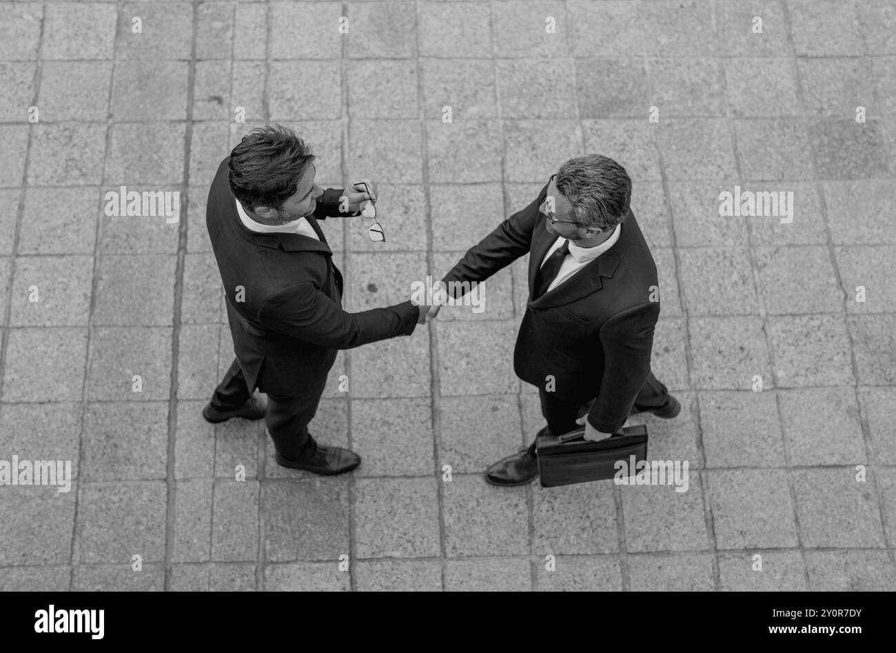 Business man shaking hands. Two businessmen handshake outdoor ...