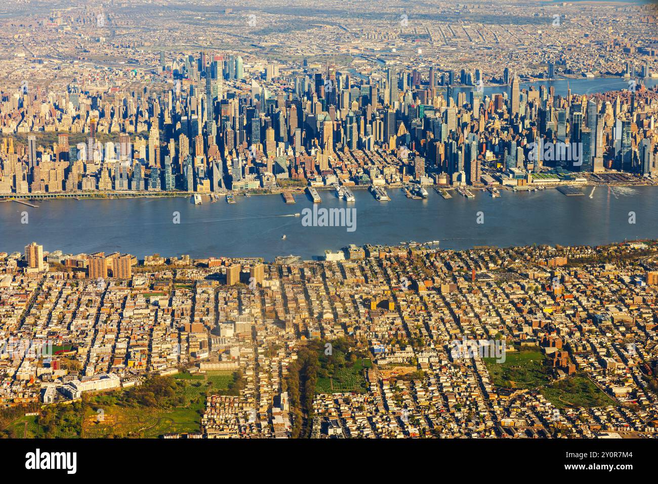 Aerial view from an airplane flying over New York with Manhattan, the ...