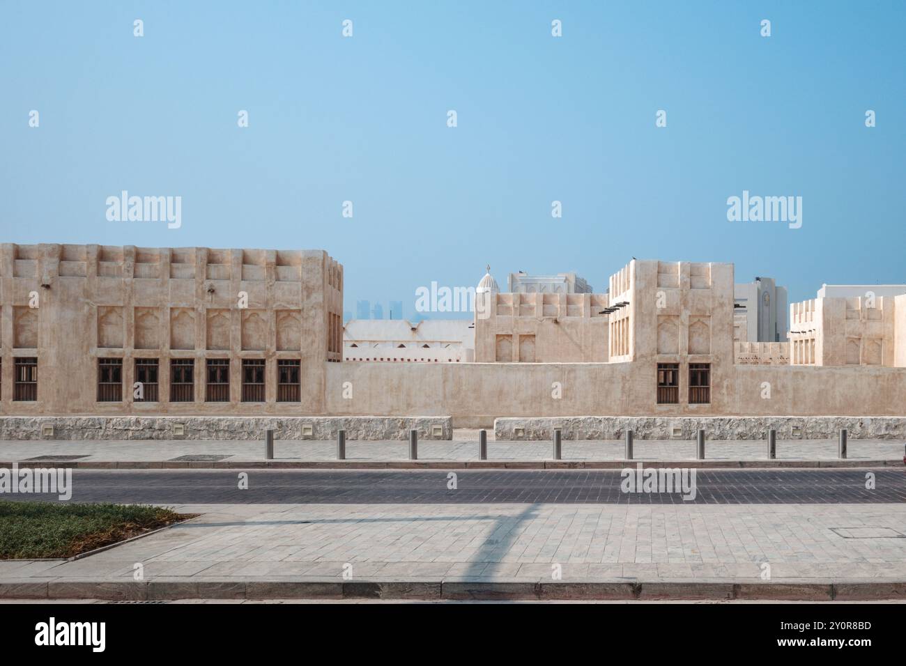 The exterior of a traditional Middle Eastern mud brick building with a ...