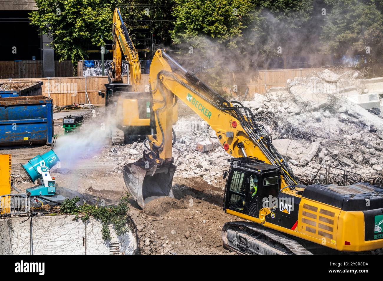 Water cannon, snow cannon, sprays water onto the construction site on ...