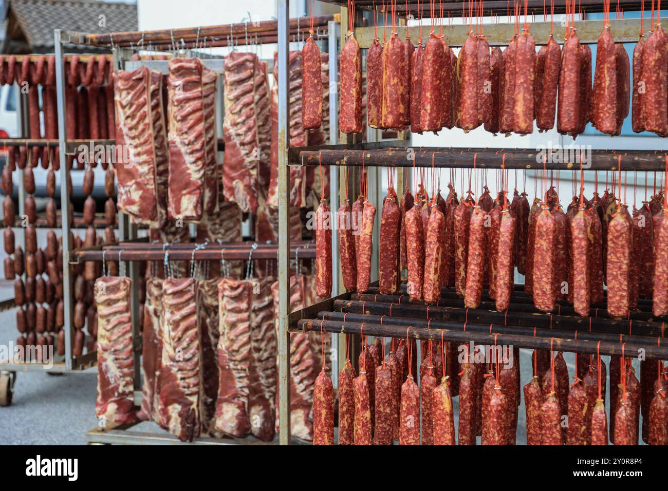 Drying saussages and bacons in the traditional method by hanging meat ...