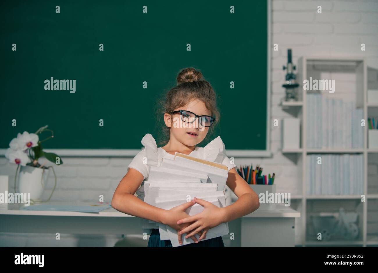 School girl studying math on lesson in classroom at elementary school ...