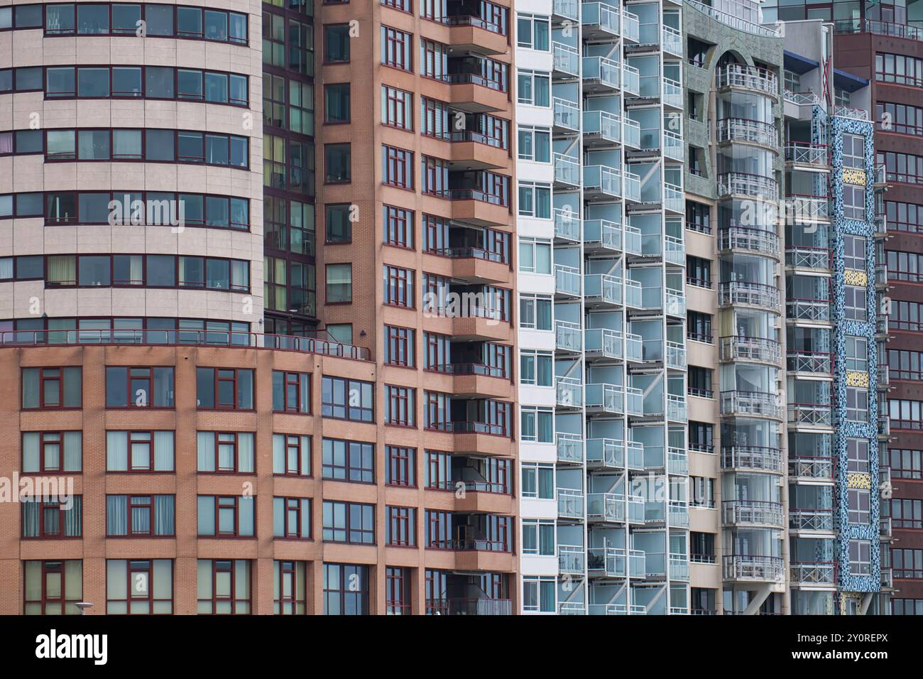 Pastel-colored high-rise buildings with lots of windows and balconies ...