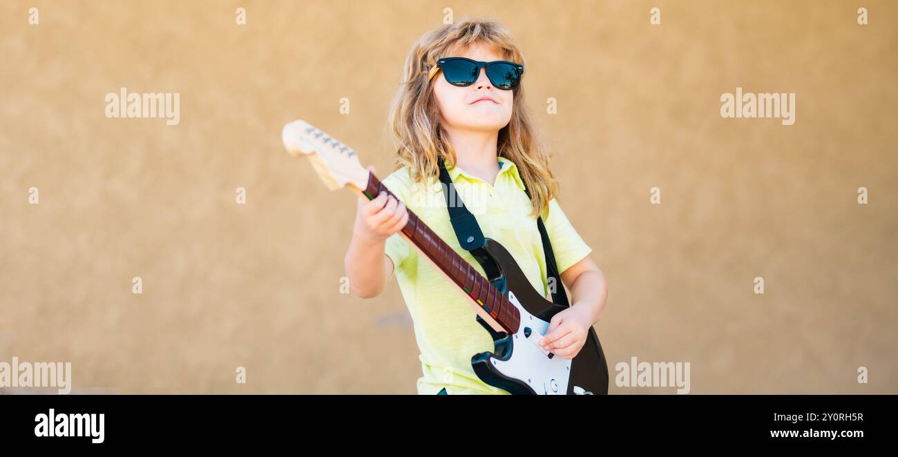 Kid with guitar. Portrait of cute child boy at guitar practice, funny ...