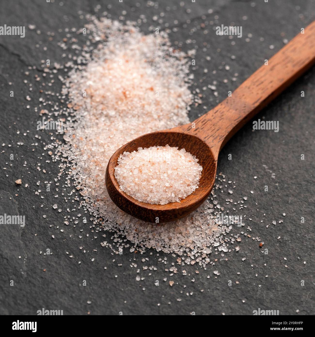 Fine pink salt sprinkled - Fine Himalayan crystals in spoon Stock Photo ...