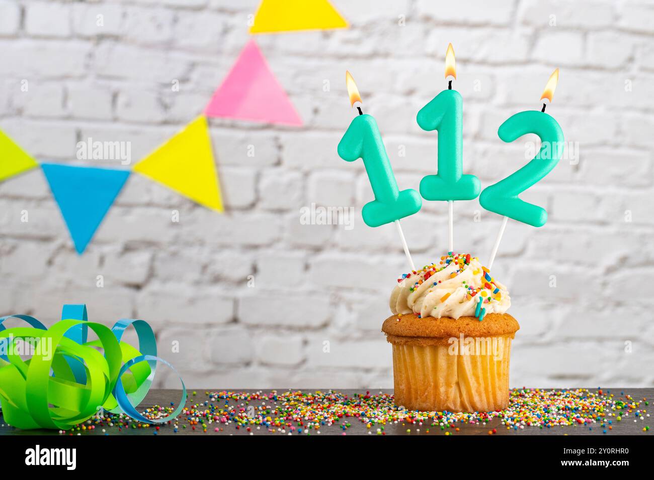 Candle number 112 - Birthday celebration with cupcake Stock Photo - Alamy