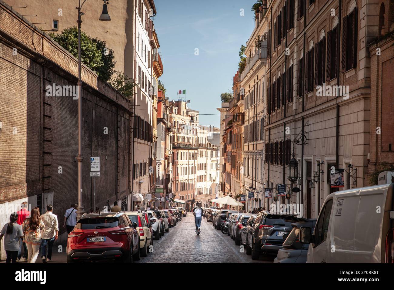 ROME, ITALY - JUNE 14, 2024: Tourists on an electric scooter moving ...