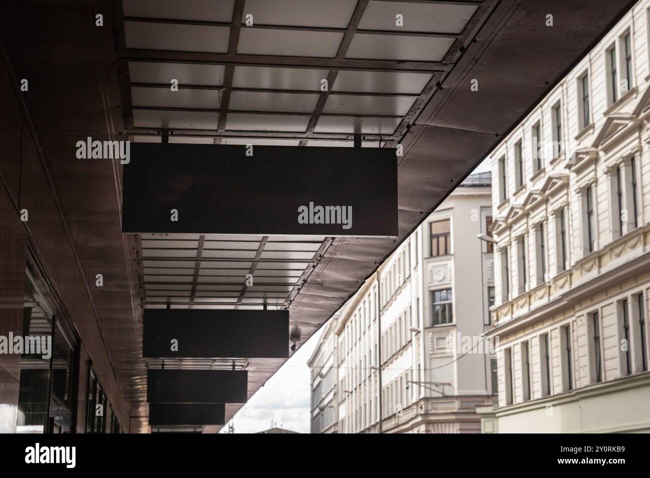 Several empty black signs in front of stores. These blank signage ...