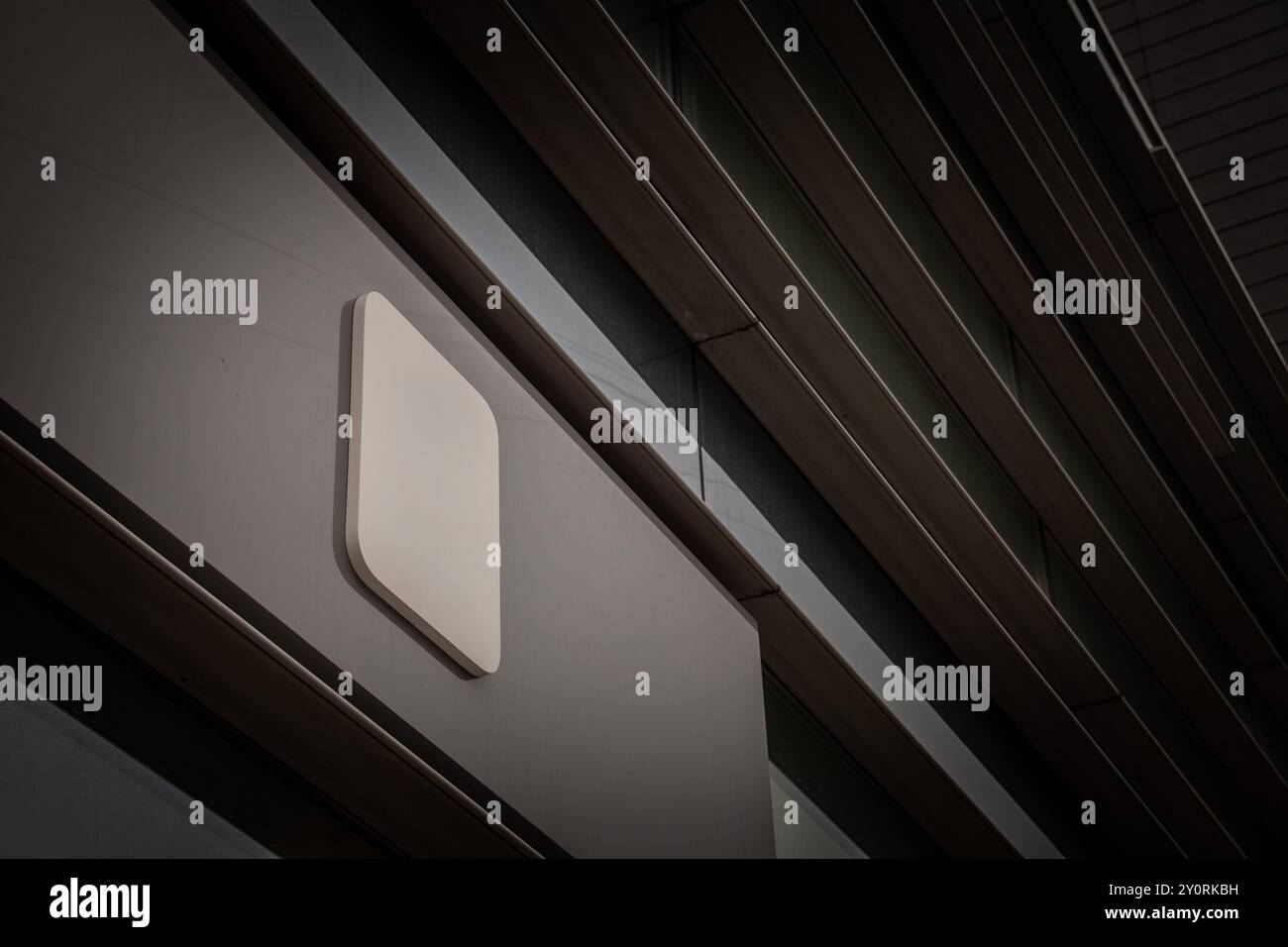 Empty gray sign in front of a modern shop. The blank signage stands out ...