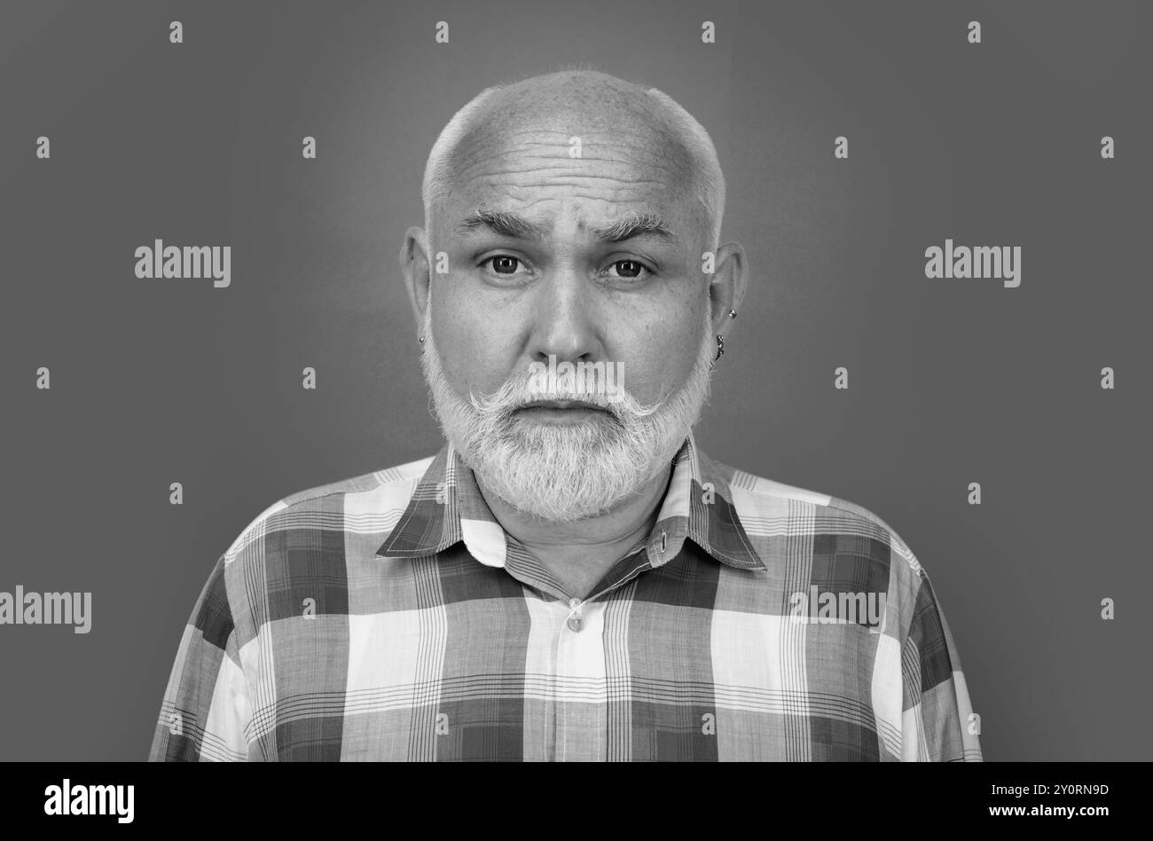 Closeup emotional portrait of an old mature senior man with grey beard ...