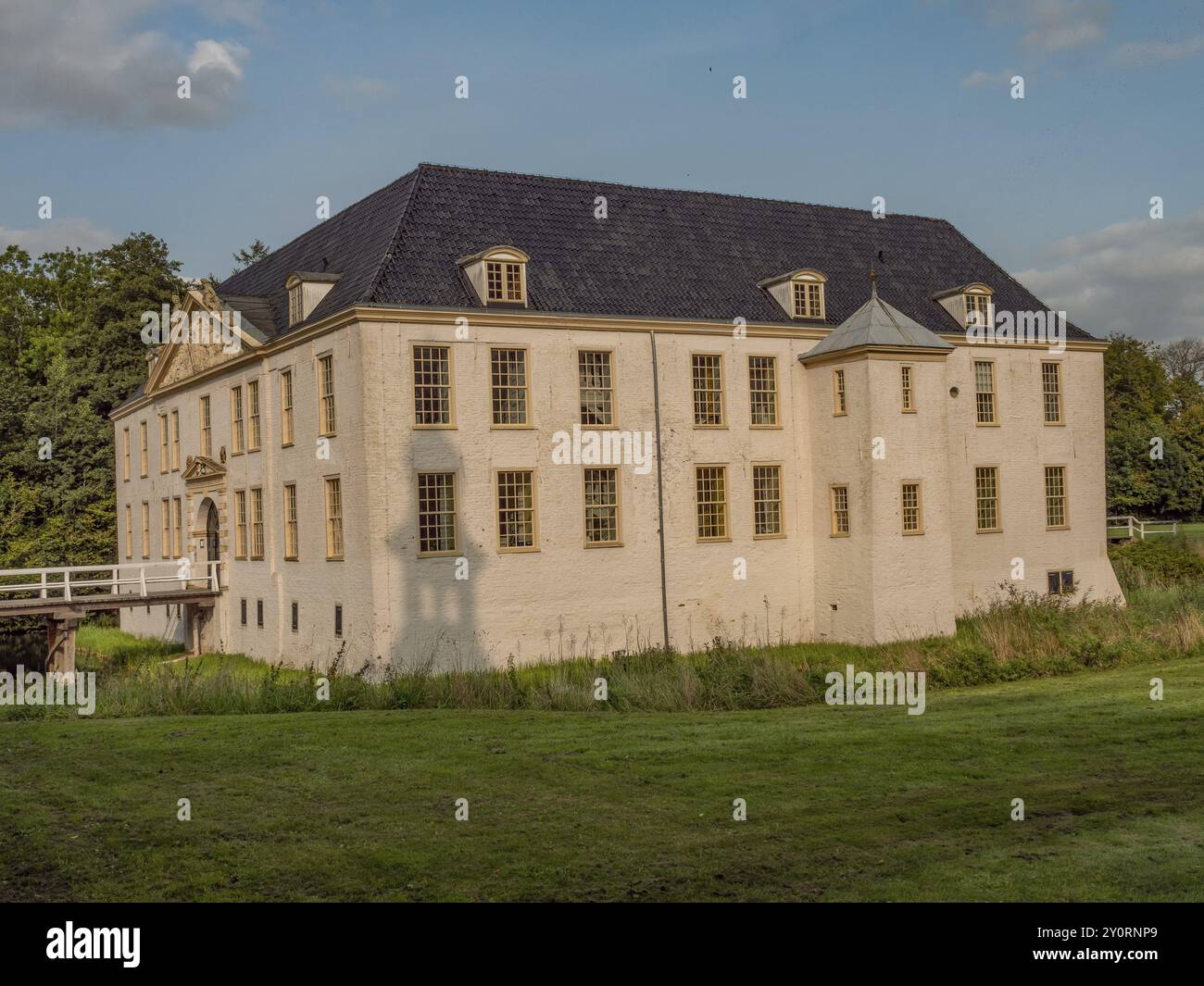 Historic castle with white walls and blue roof, nestled in a large ...