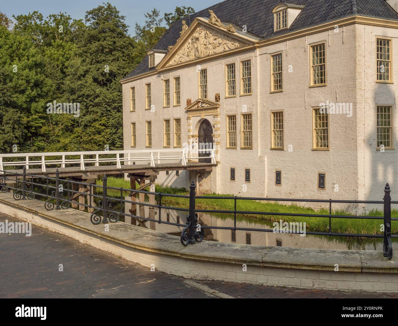 Historic white castle on the moat with decorative facade and blue roof ...