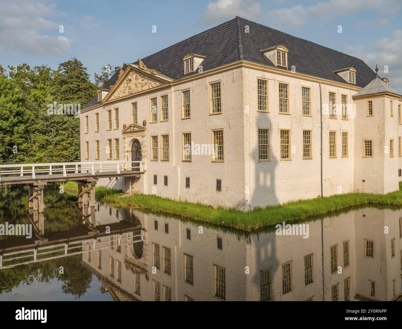 Majestic castle with white facades and blue roofs, perfectly reflected ...