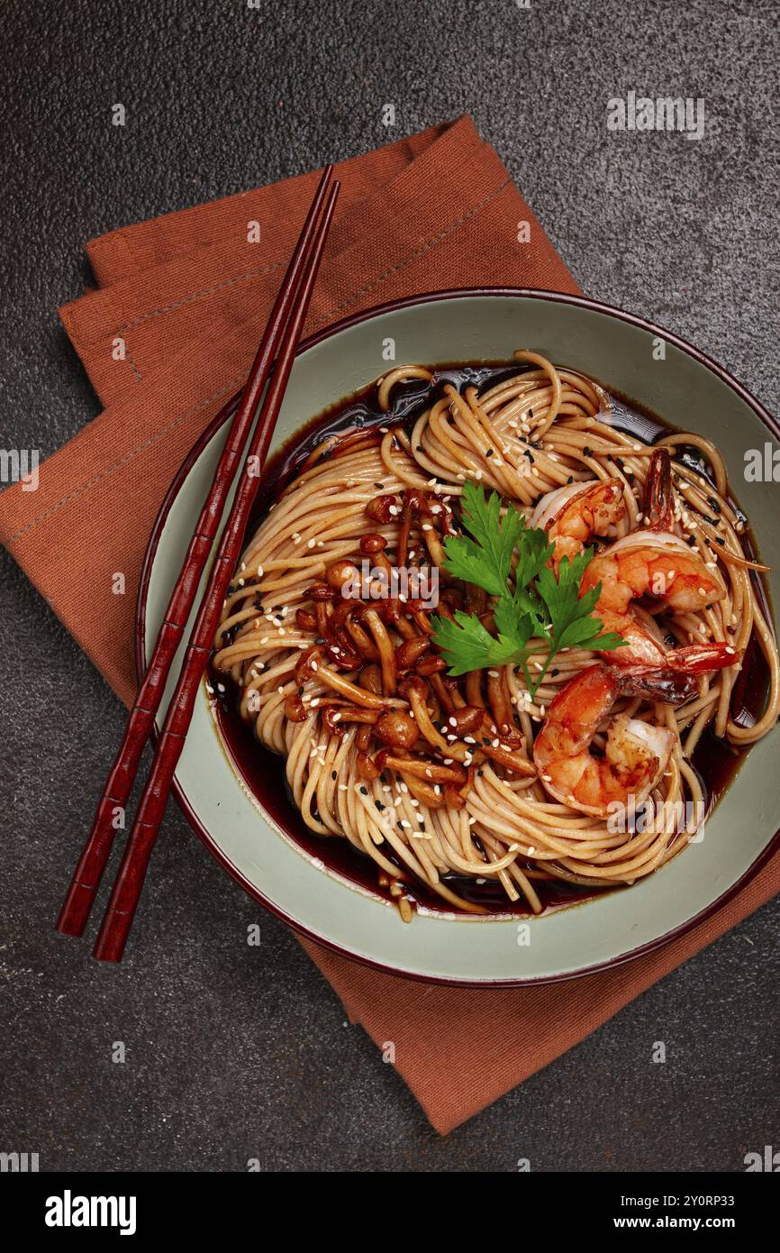 Soba, buckwheat noodles, with shimeji mushrooms and tiger shrimps ...