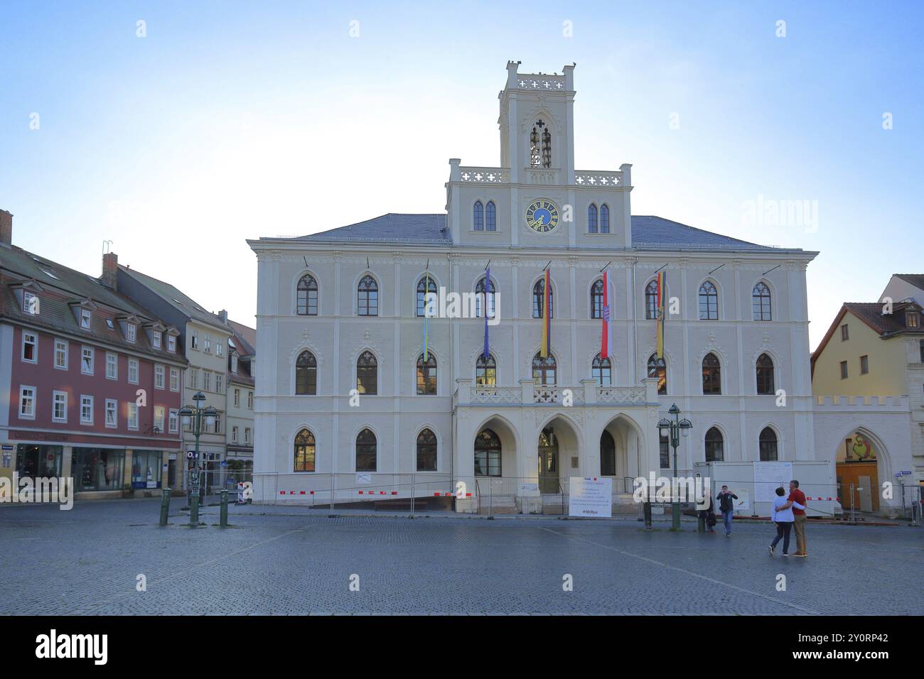 Historic neo-Gothic town hall with national flags, landmark, market ...