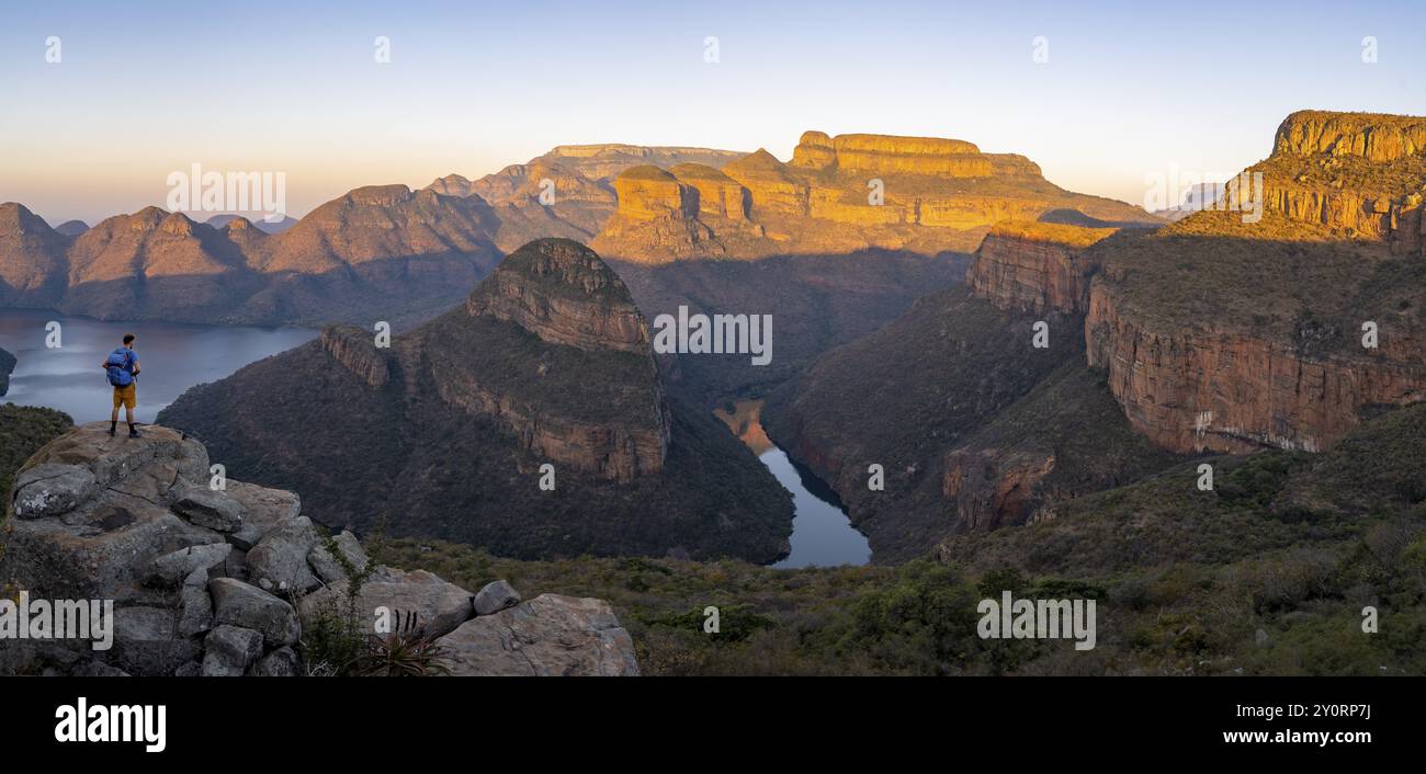 Tourist enjoying the view from a rock, Panorama, Sunset at Blyde River ...
