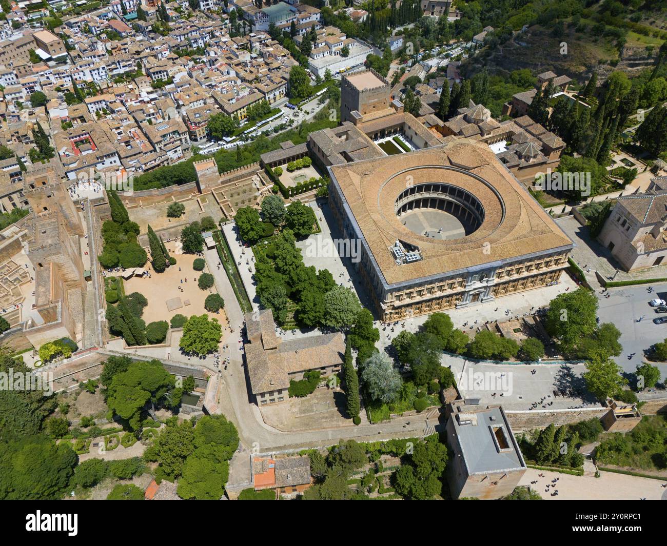 Historic city with striking round building, surrounded by trees and ...