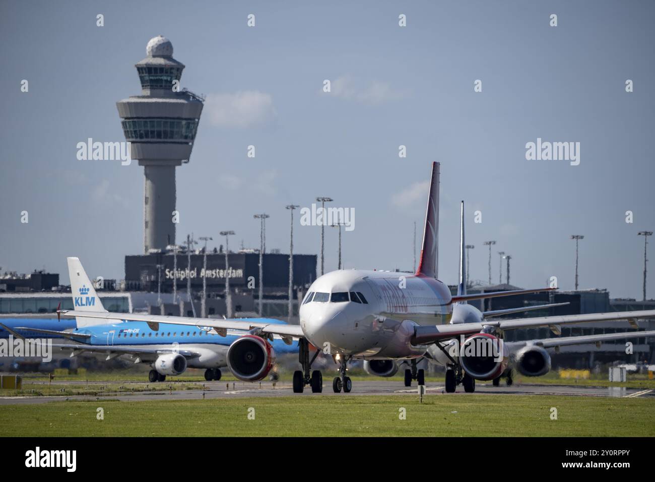 Aircraft at Amsterdam Schiphol Airport, on the taxiway for take-off on ...