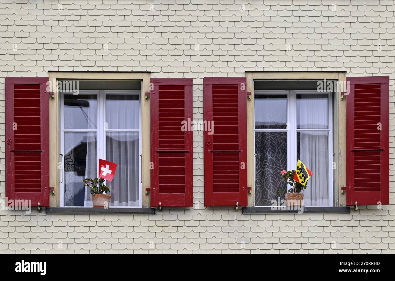 Window with Swiss and Bernese flags Stock Photo - Alamy