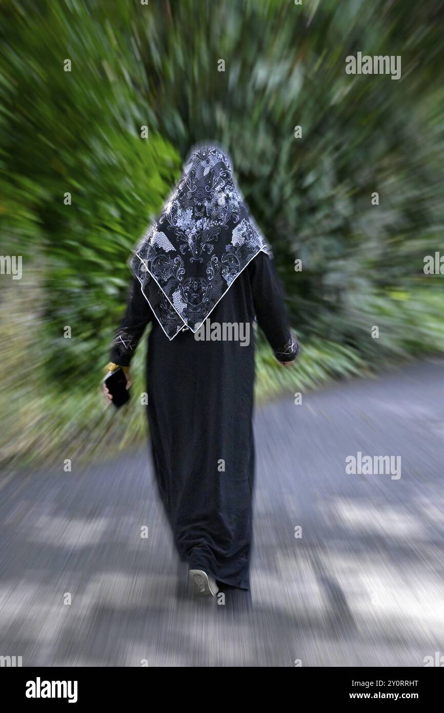 Woman wiping head outdoors hi-res stock photography and images - Alamy