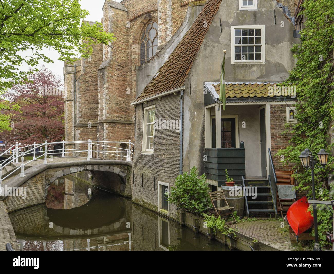 Historic architecture with a small stone bridge and brick buildings ...