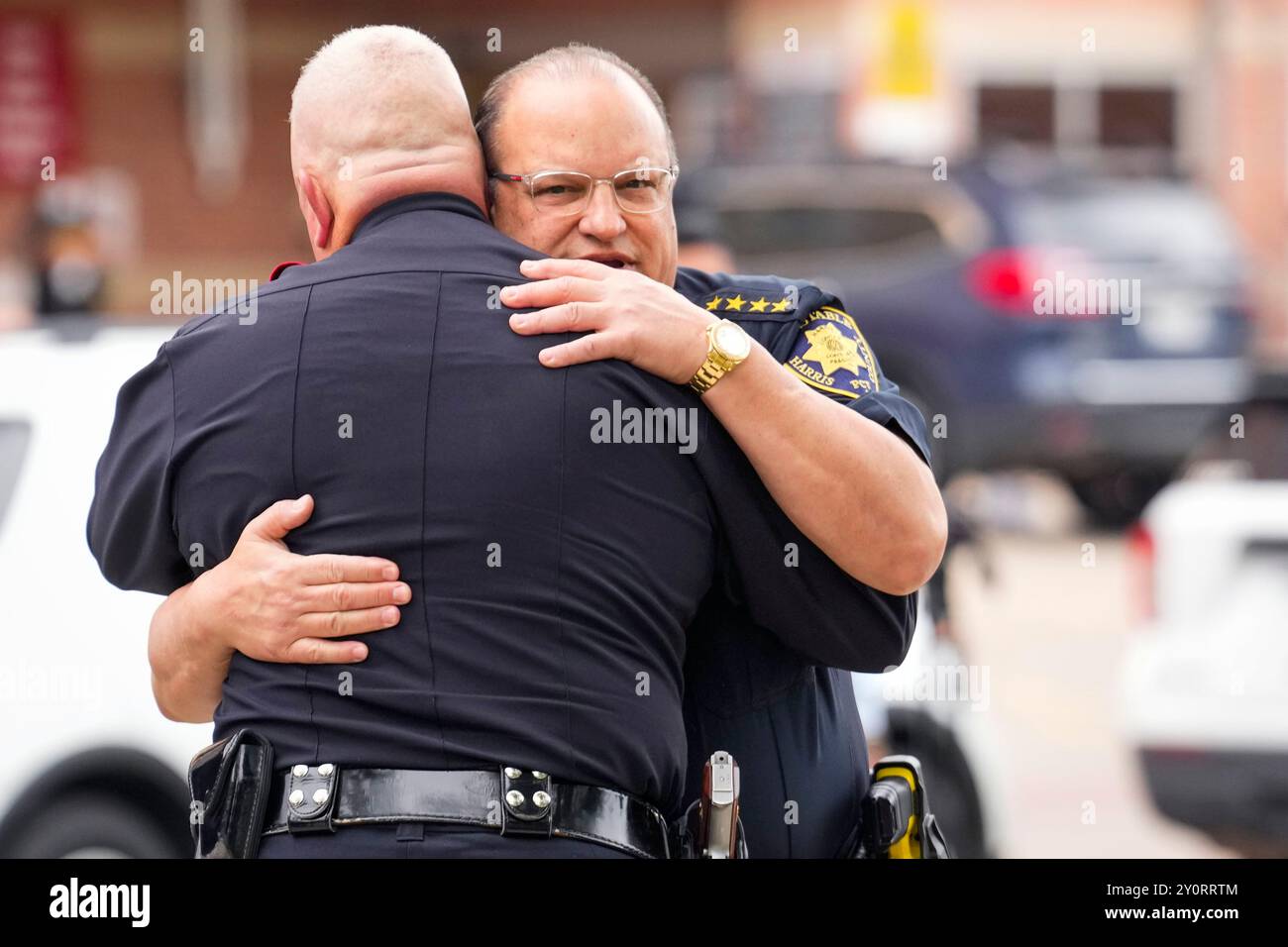 Harris County Precinct 4 Constable Mark Herman, left, is embraced by ...